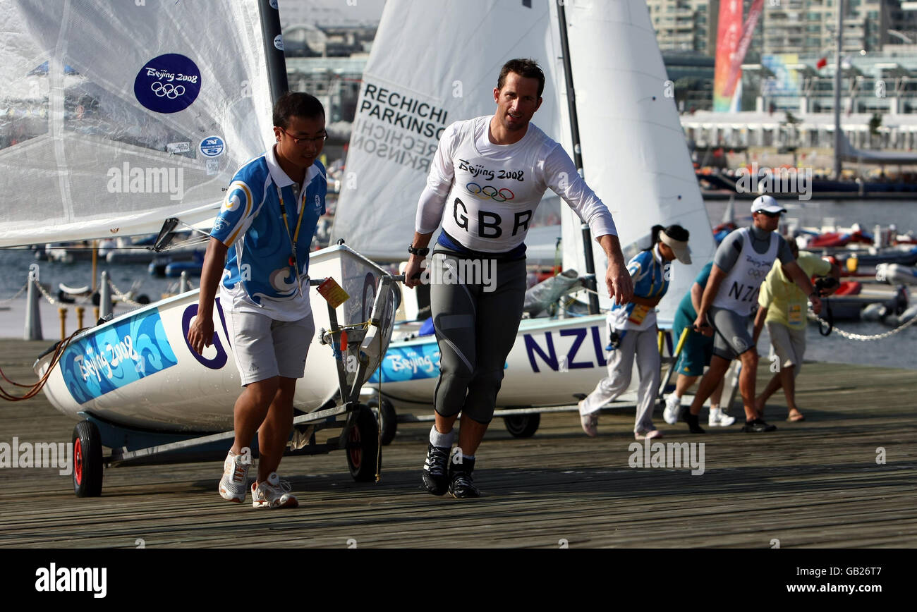 Great Britain's Finn sailor Ben Ainslie hauls his boat out of the water ...