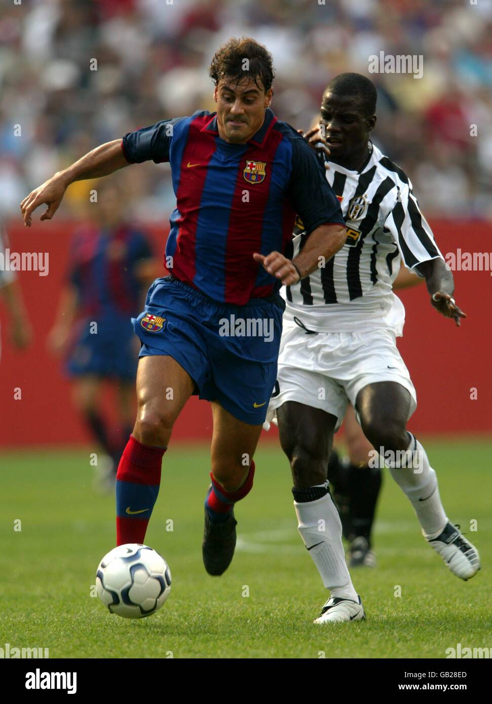 Barcelona's Dabi Garcia gets away from Juventus' Stephan Appiah Stock ...