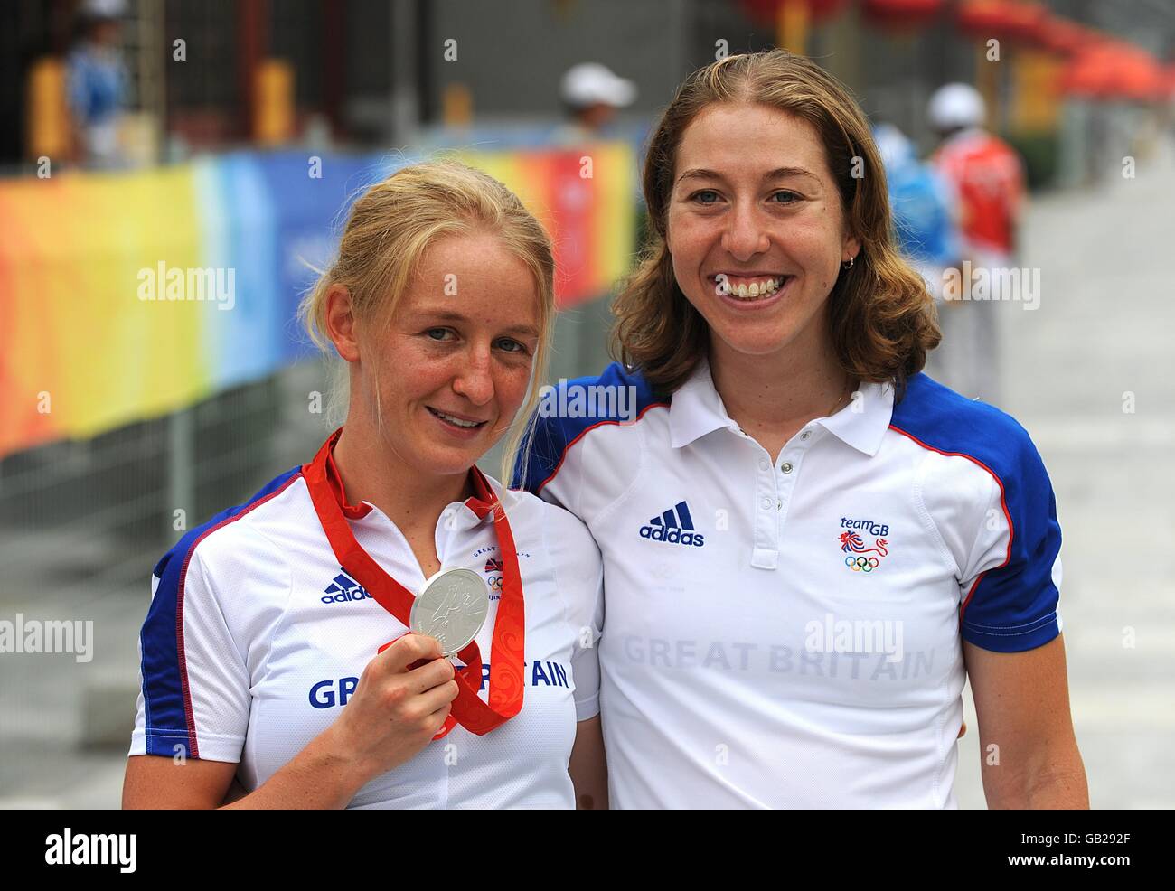 Great Britain's Nicole Cooke (r) and Emma Pooley with her Silver medal ...