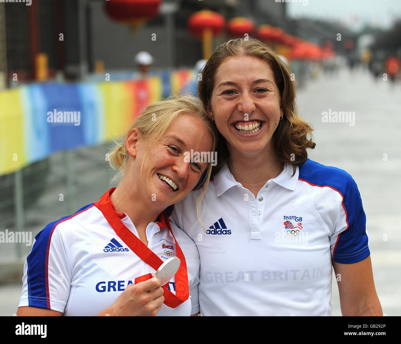 Great Britain's Nicole Cooke (r) and Emma Pooley with her Silver medal ...