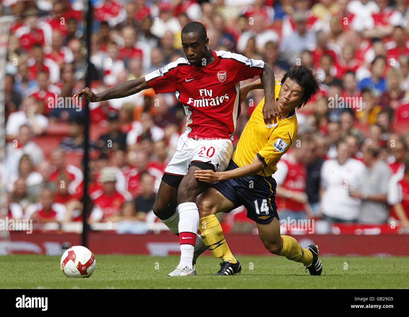 West Bromwich Albion's Do-heon Kim and Arsenal's Johan Djourou battle ...