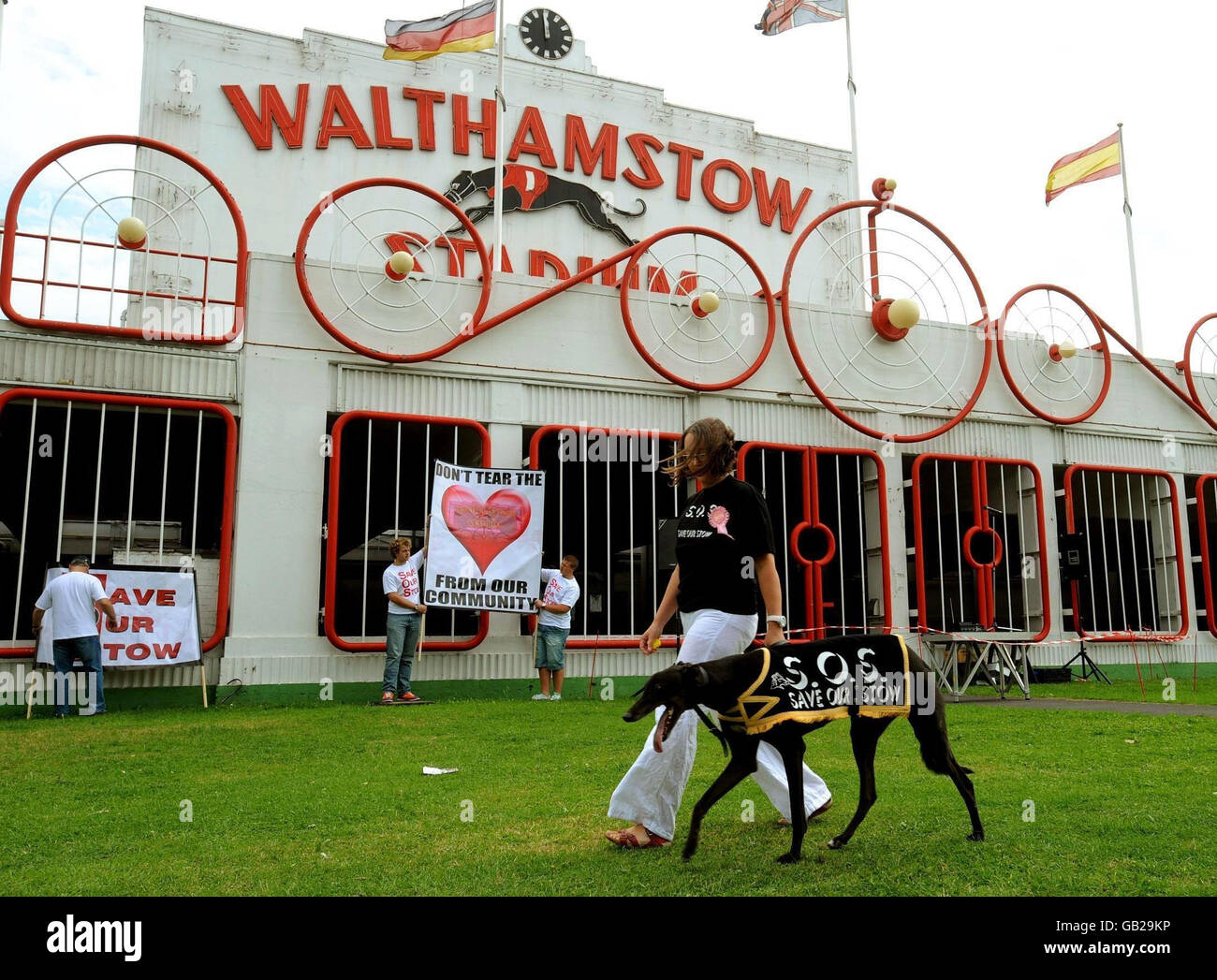 Emma Johns and her greyhound 'Whippy' walk past the main entrance to ...