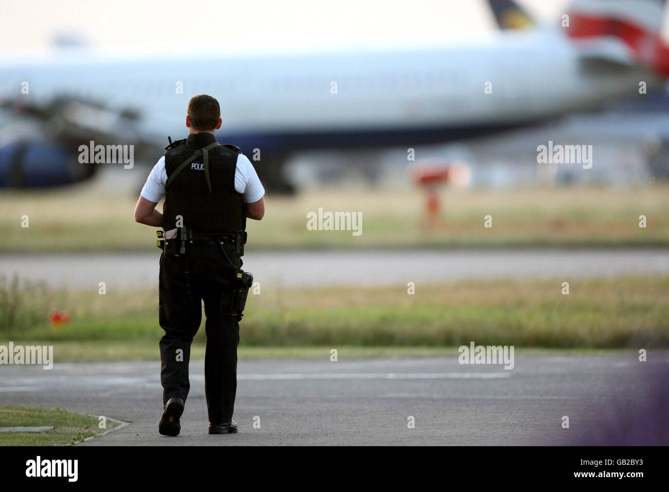 Police Officers Patrol at Heathrow Airport Stock Photo - Alamy