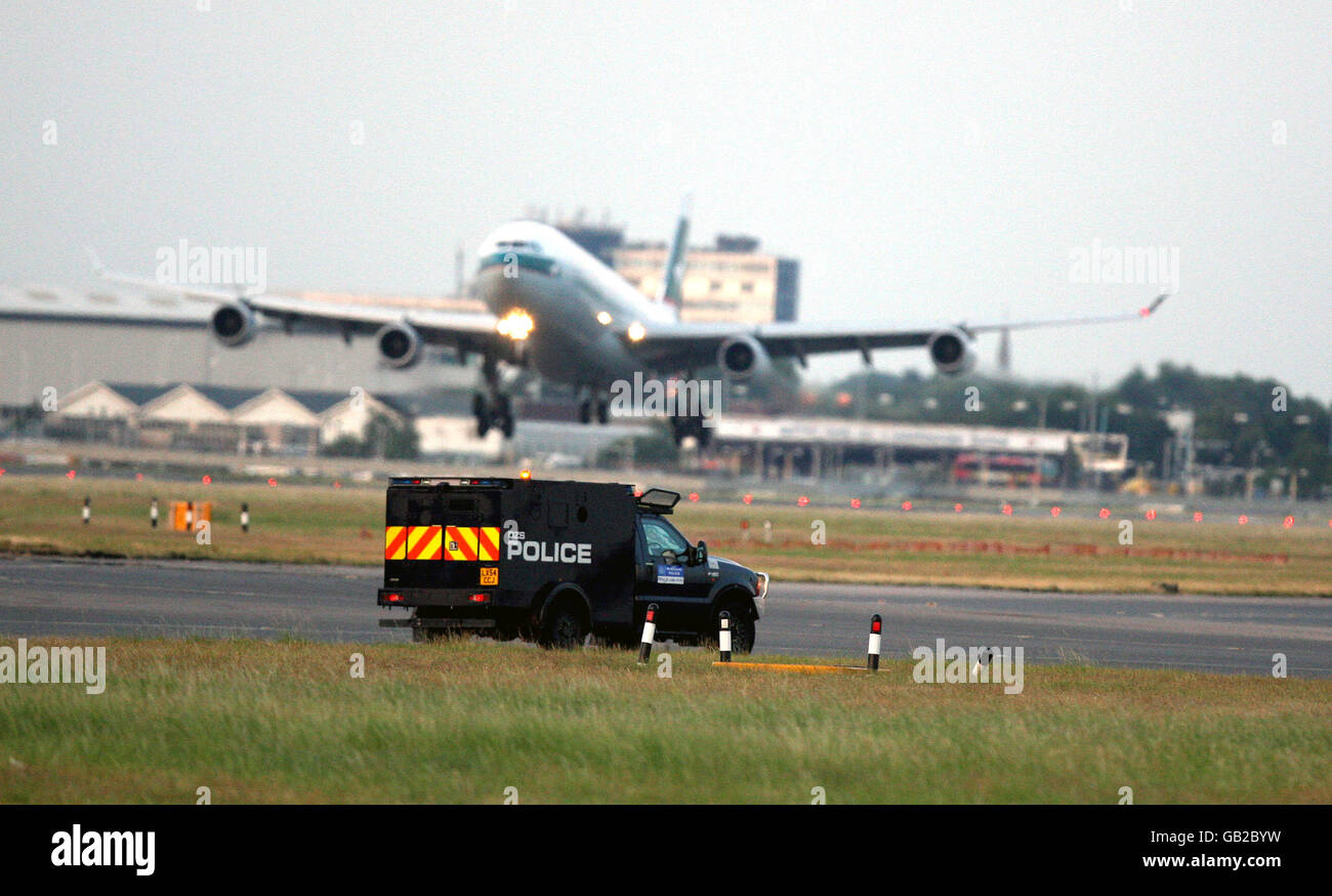 Police Officers Patrol at Heathrow Airport Stock Photo - Alamy