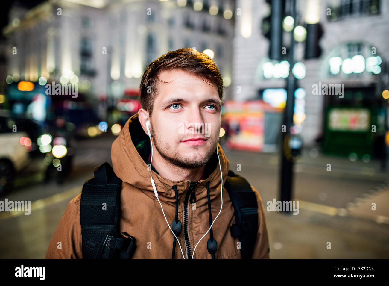 Man walking in the streets of London at night Stock Photo - Alamy