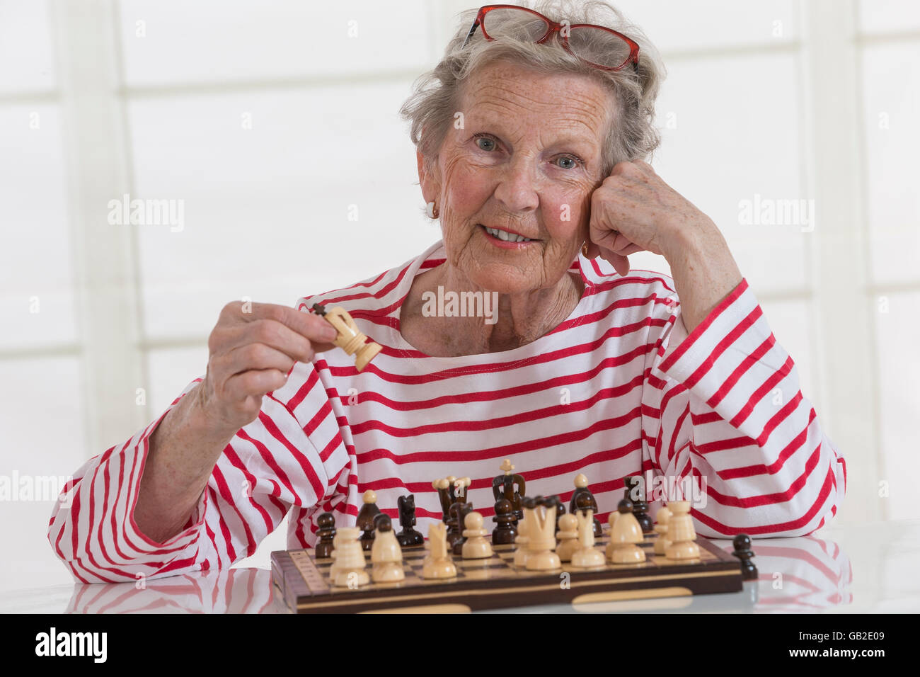 Senior Woman Playing Chess Stock Photo - Alamy