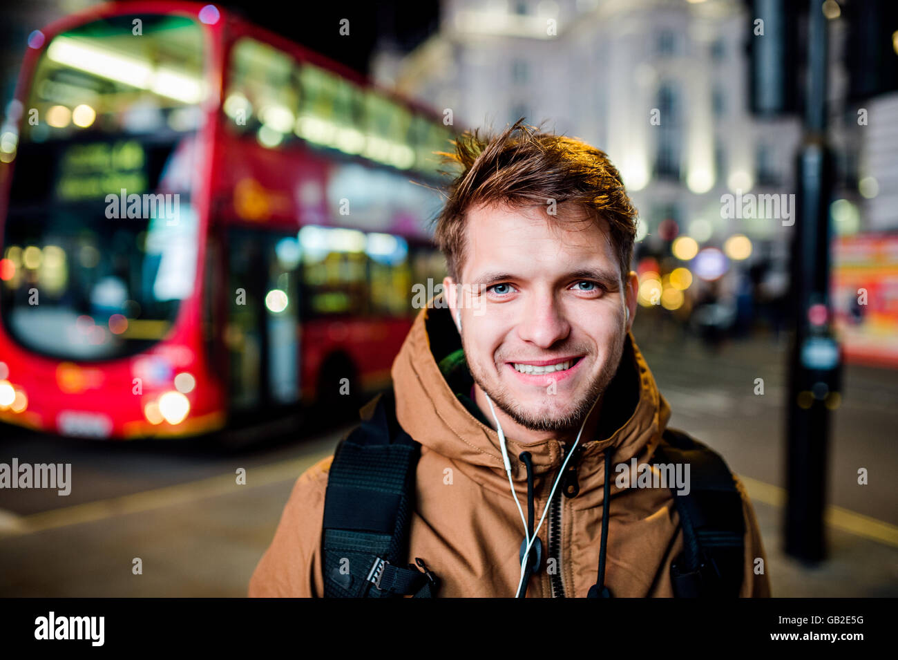 Man walking in the streets of London at night Stock Photo - Alamy