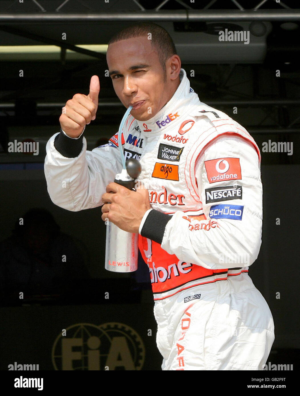 Great Britain's Lewis Hamilton celebrates taking pole position during ...