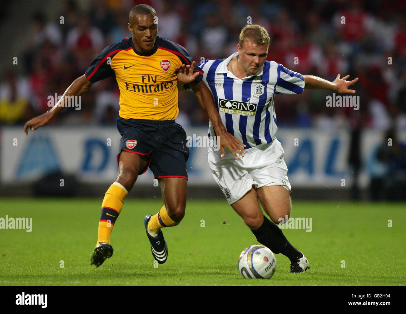 Huddersfield's Robbie williams (right) in action with Arsenal's Jay ...