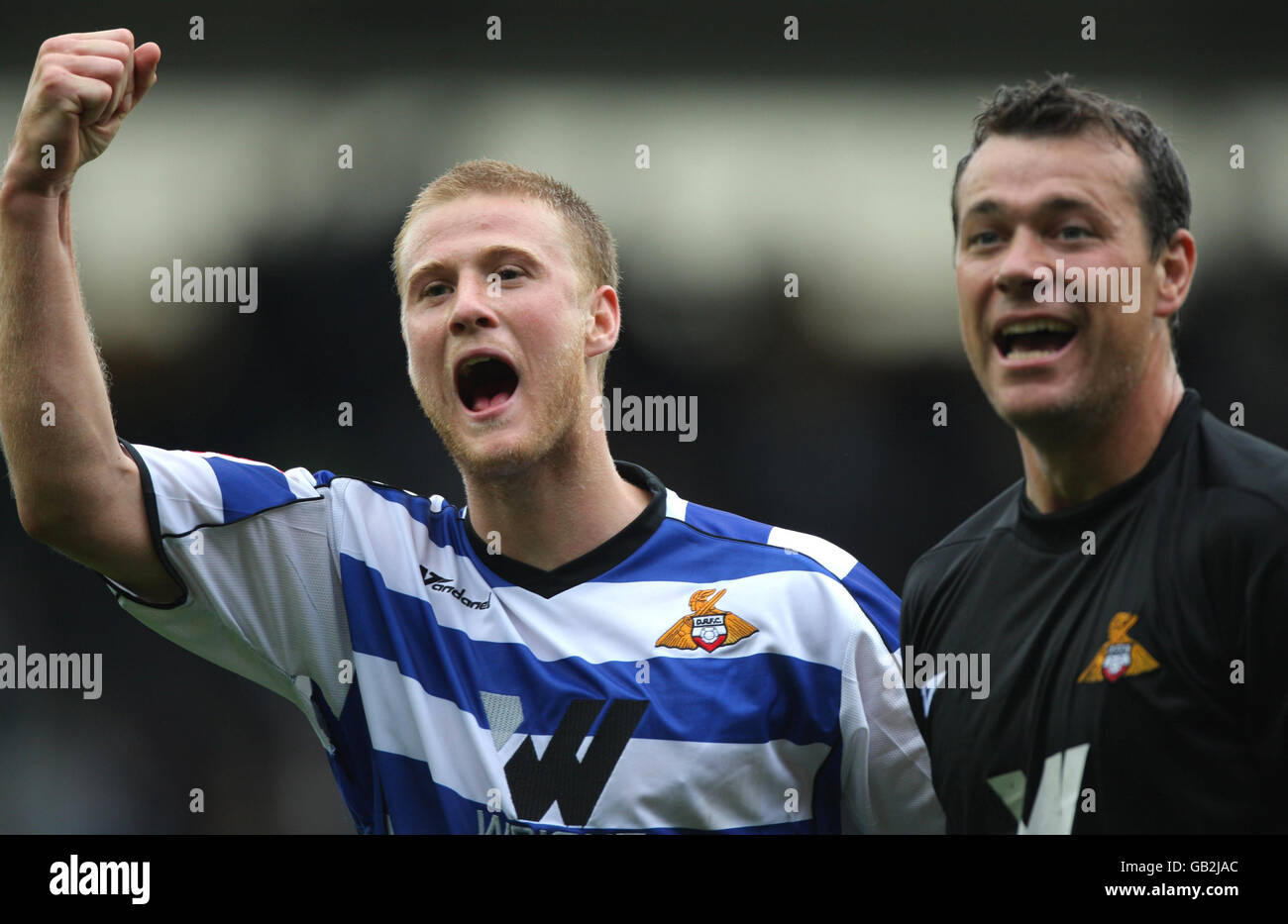 Doncaster Rovers' Matthew Mills (left) and goalkeeper Neil Sullivan ...