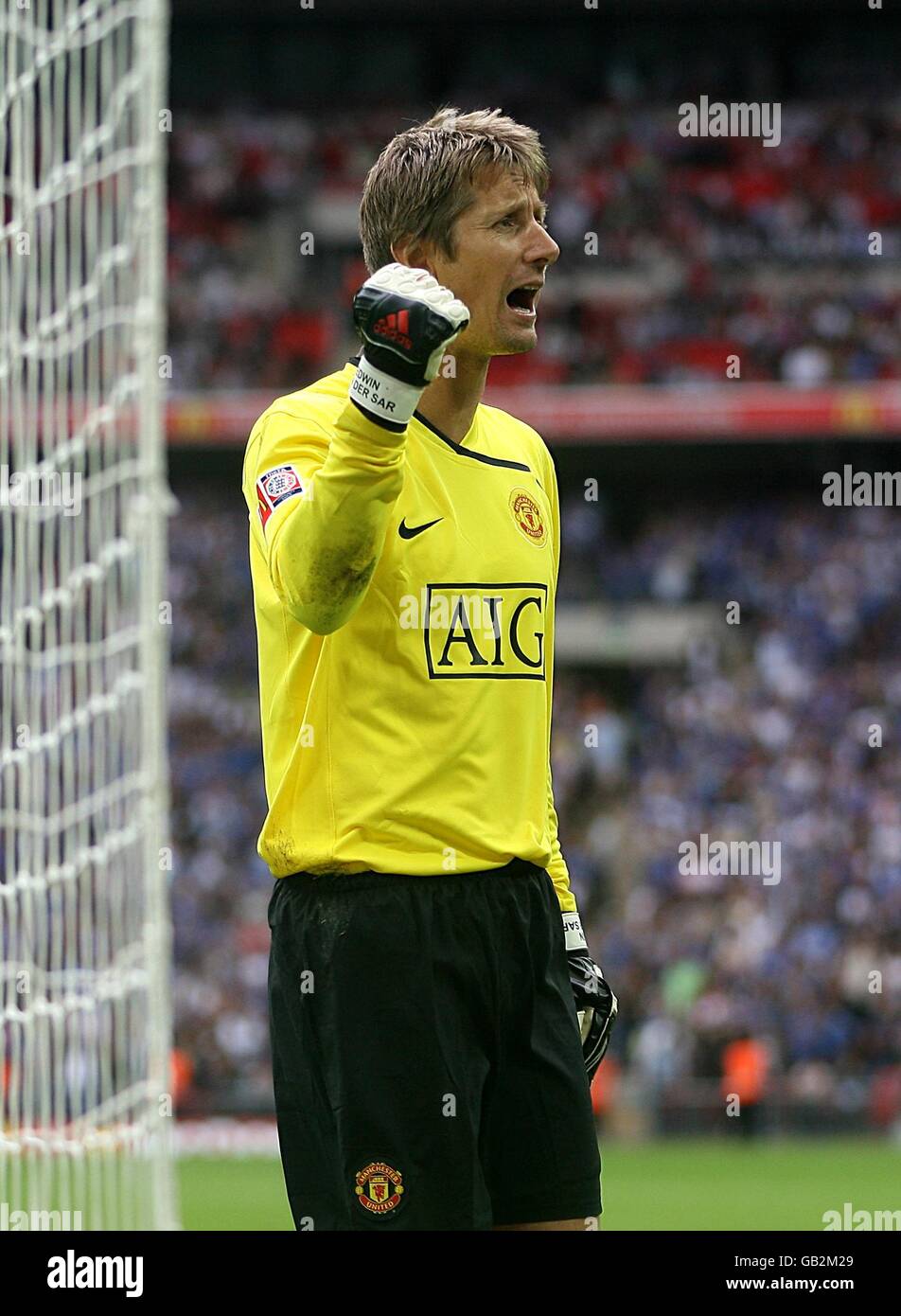 Manchester United goalkeeper Edwin Van der Sar celebrates saving the ...