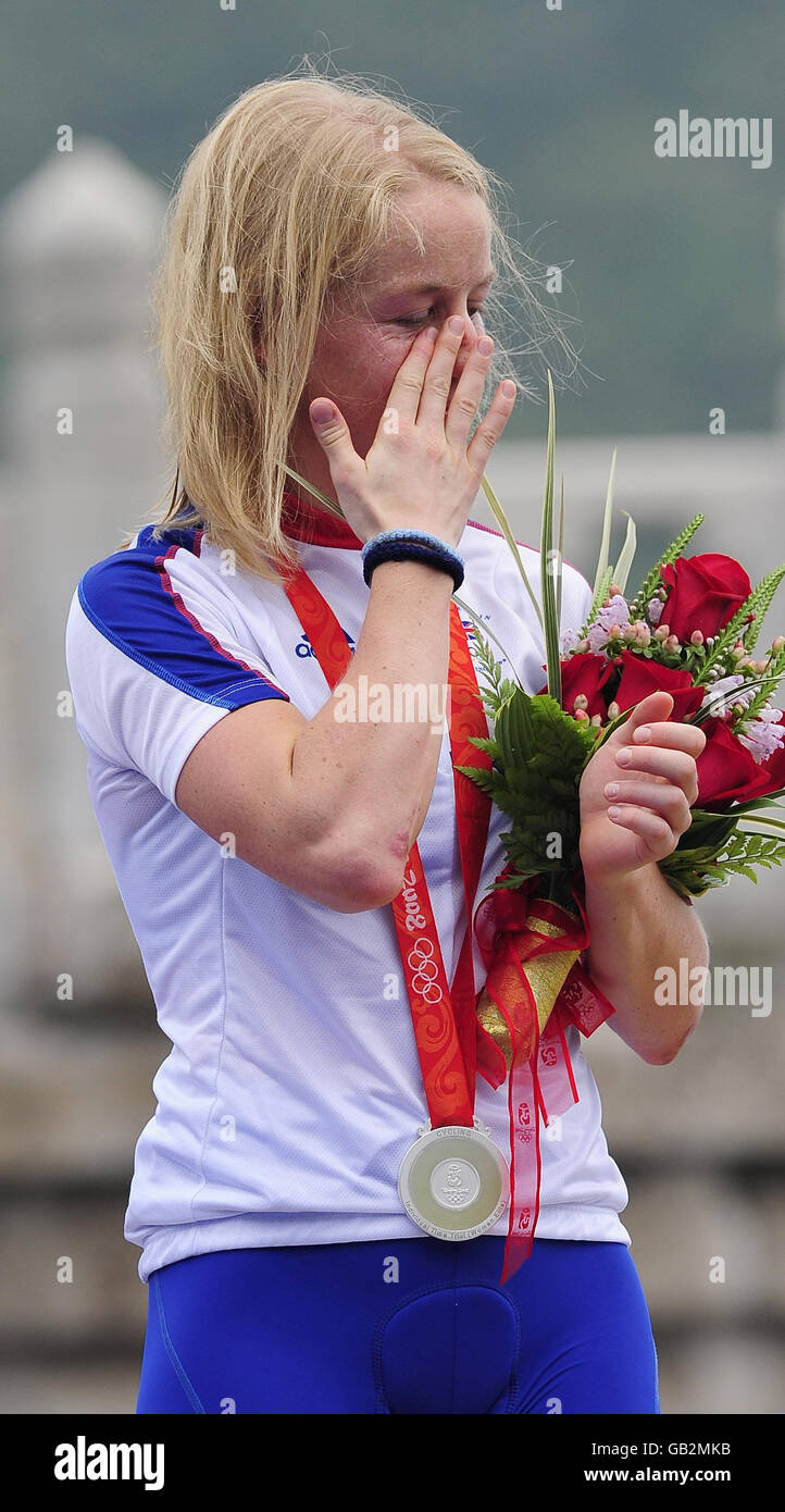 Emma Pooley wipes her eye after being presented with the Silver Medal ...