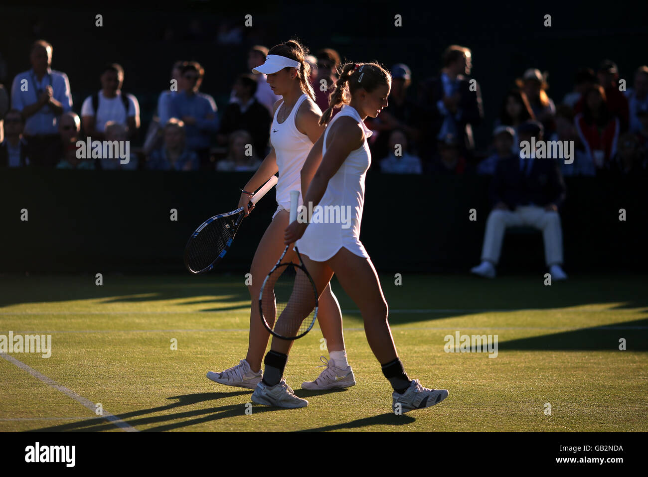 Ioana Minca (left) and Malene Helgo during their girls doubles match on ...