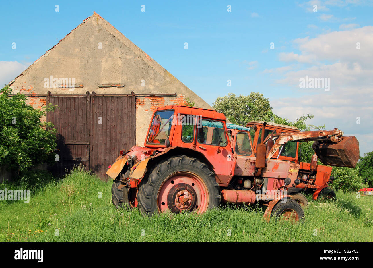 view on old tractors in a rural scene by daylight and blue sky Stock ...