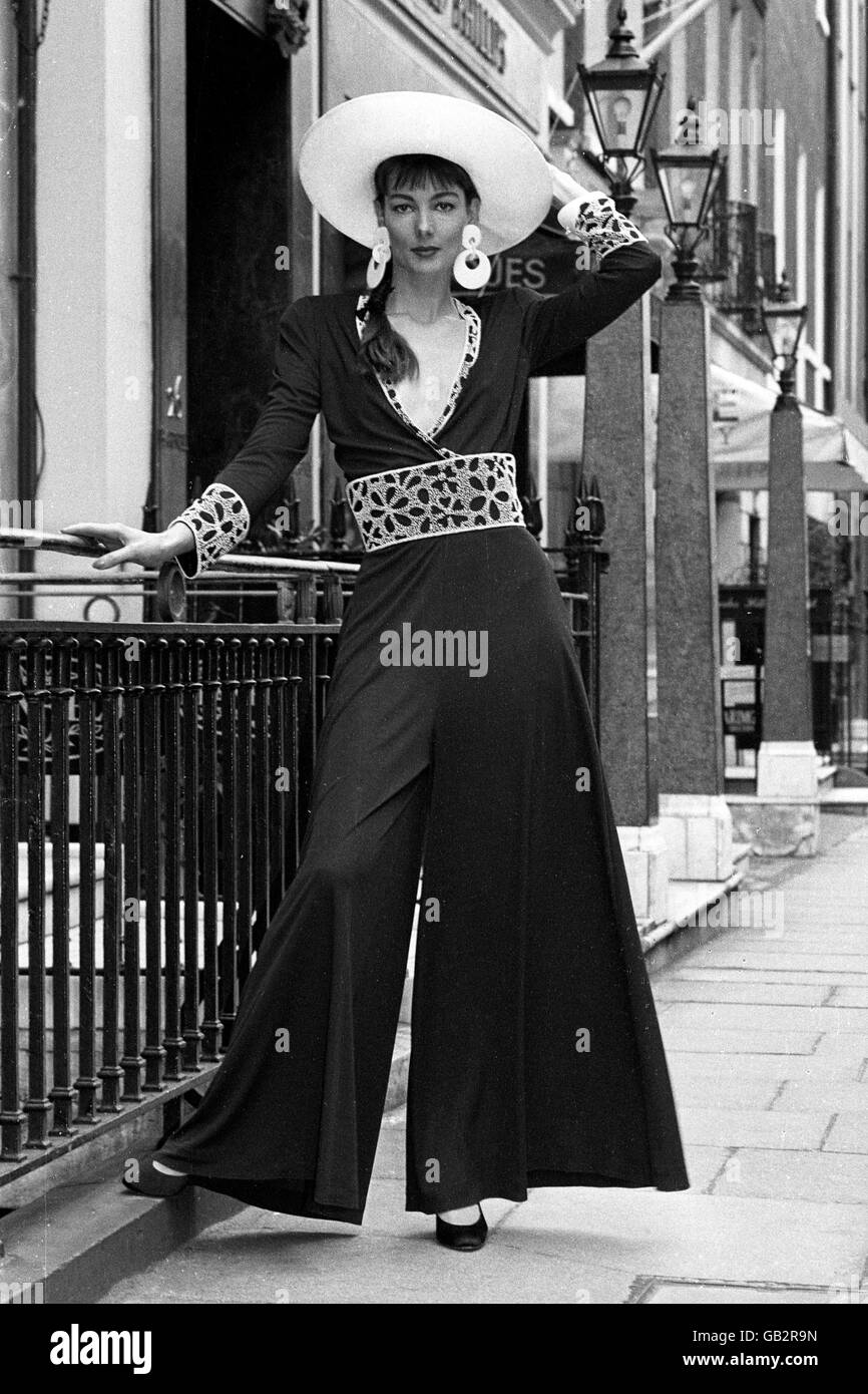 Model Sarah sets the pace with a wide-flared navy jumpsuit from Norman ...