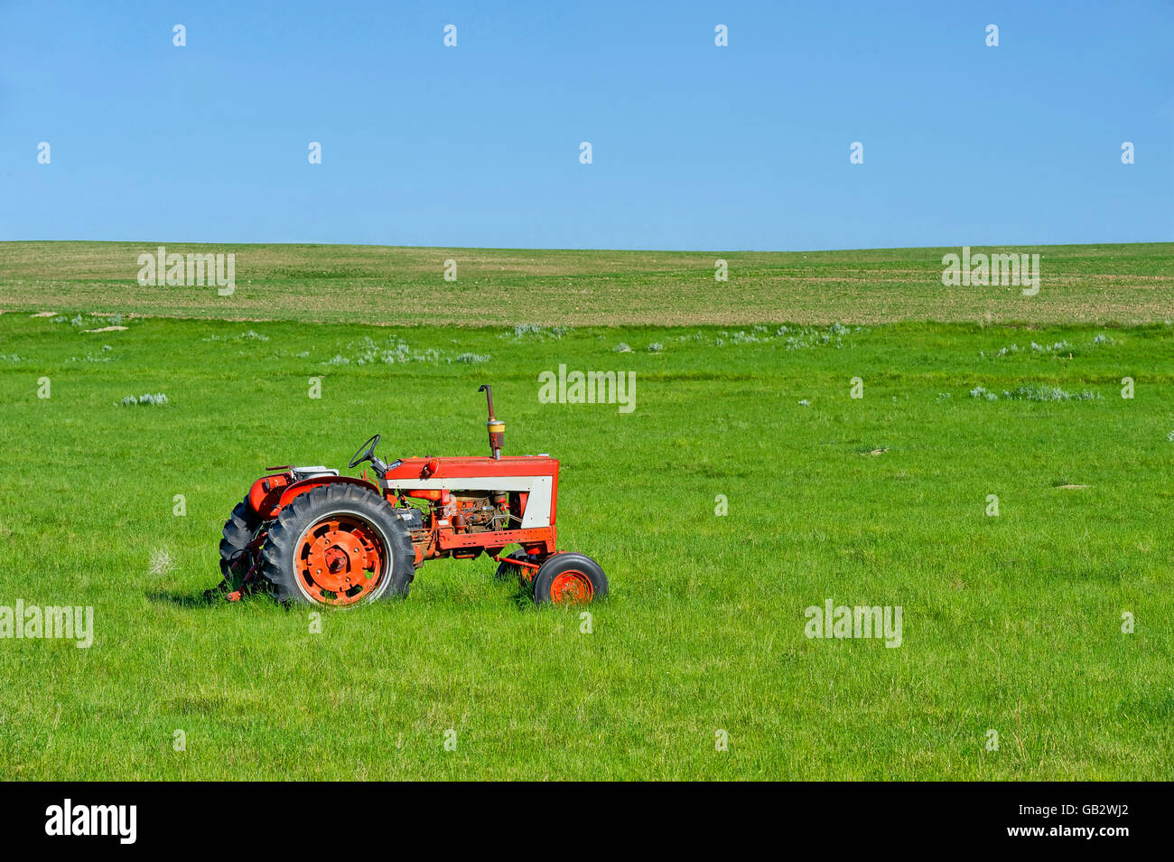 Red tractor on grass hi-res stock photography and images - Alamy