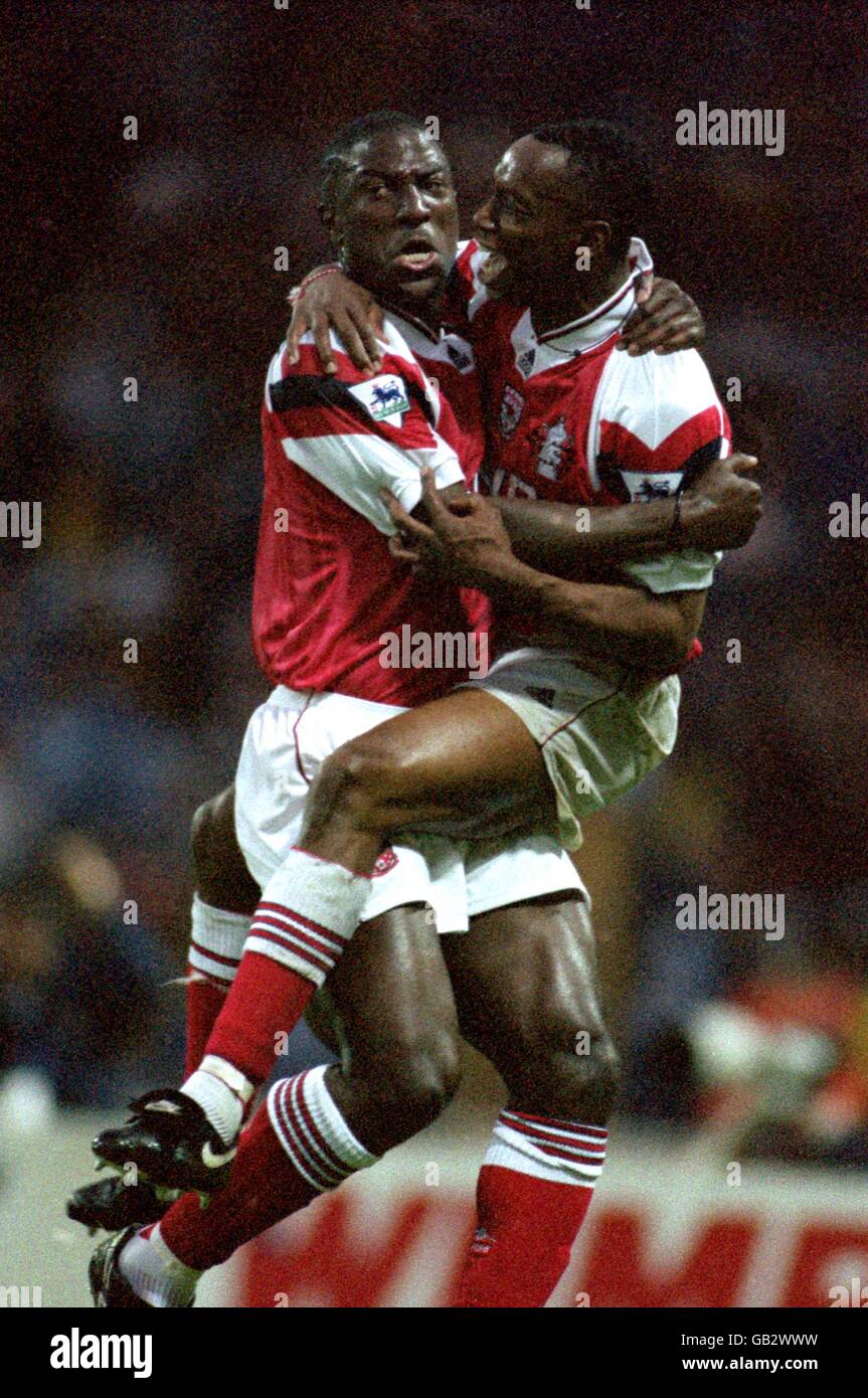 Arsenal's Ian Wright (r) celebrates scoring the opening goal with ...
