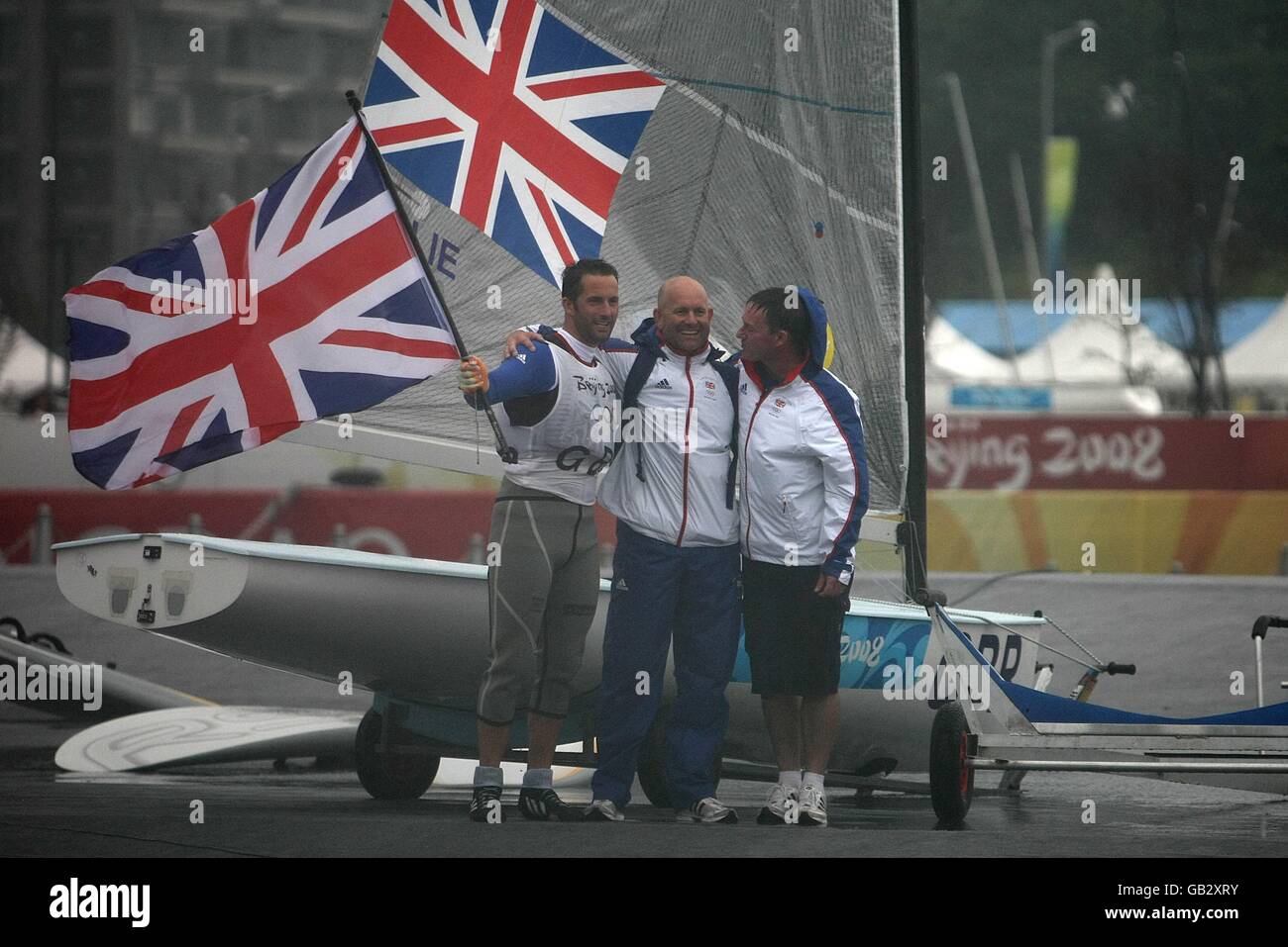 Great Britain's Finn sailor Ben Ainslie (left) celebrating his Gold ...