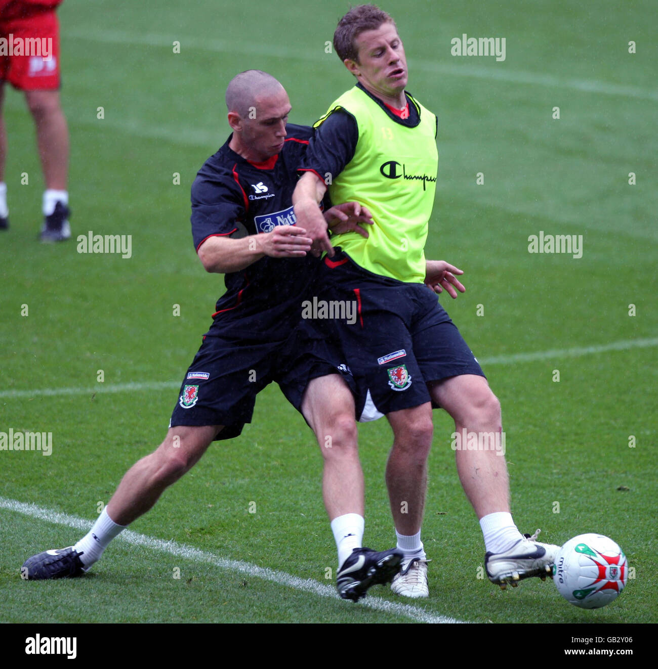 Wales' Paul Parry is challenged for the ball by Andrew Crofts (left ...