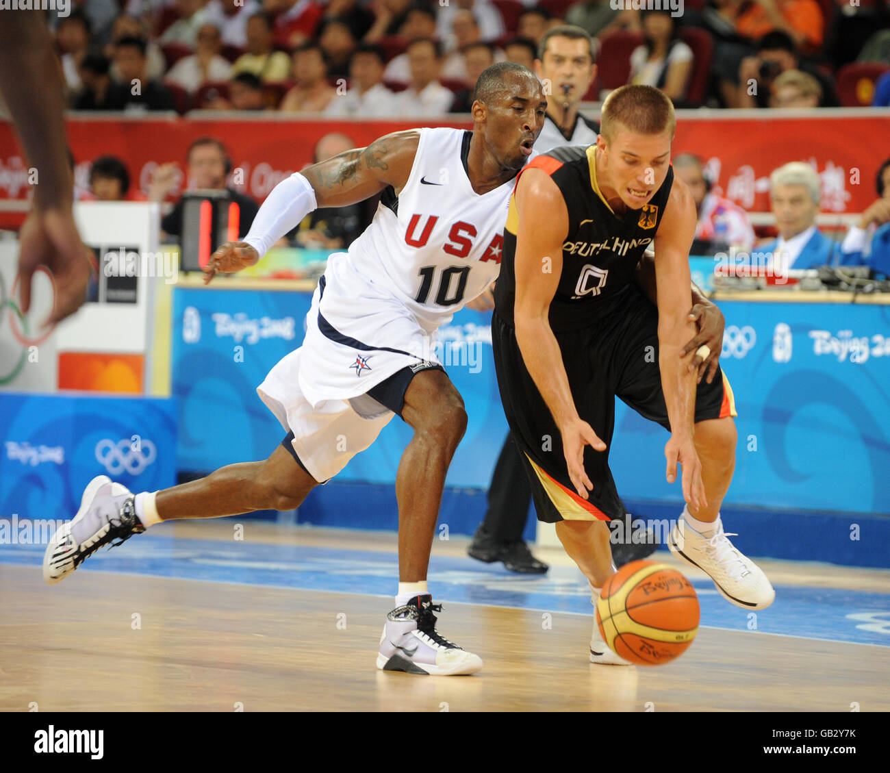 USA's Kobe Bryant and Germany's Steefen Hamann in action at the Olympic ...