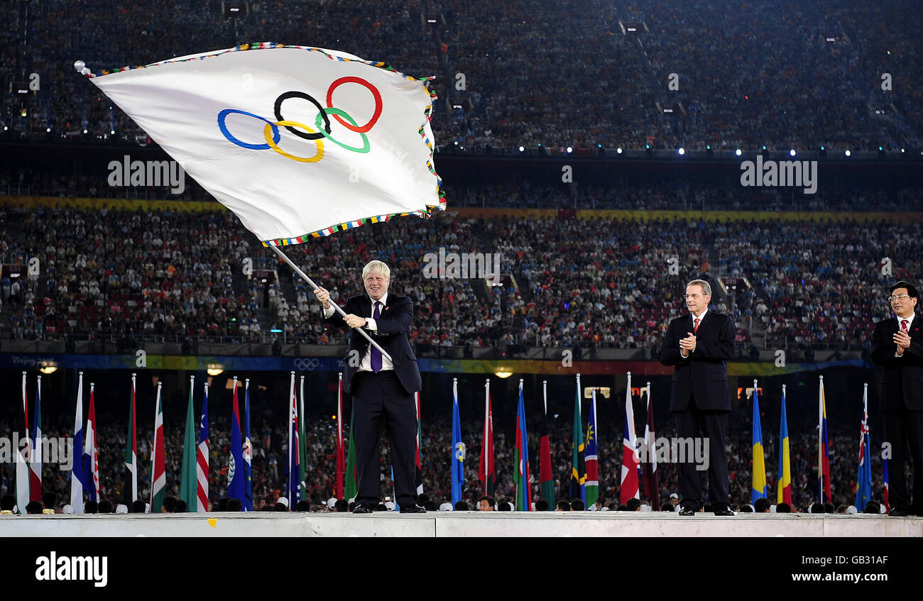 Mayor of London Boris Johnson waves the Olympic Flag during the ...