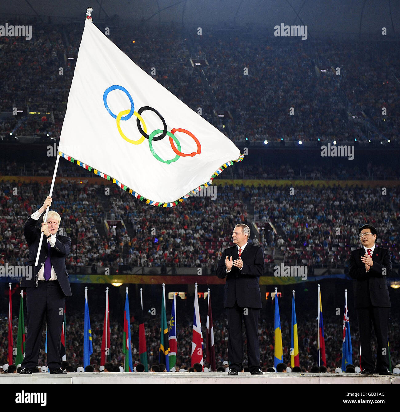 Mayor of London Boris Johnson waves the Olympic Flag during the ...