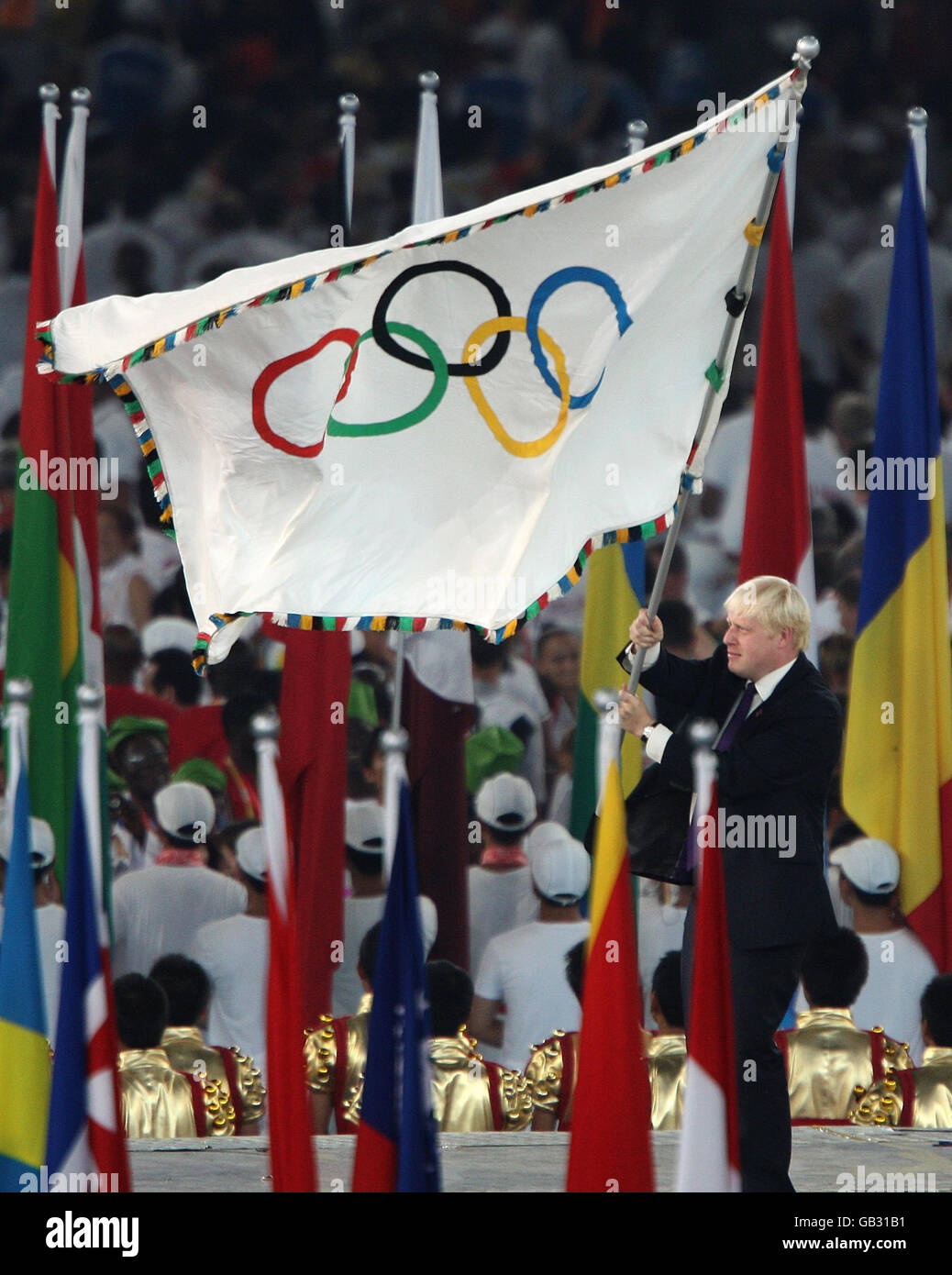 Lord Mayor of London Boris Johnson waves the Olympic flag during the ...