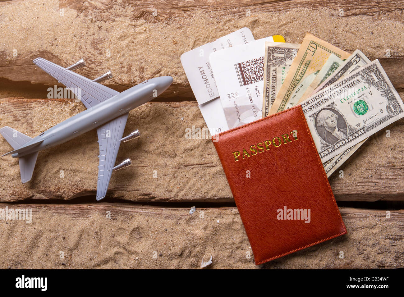 Toy plane and passport. Ticket with passport and dollars. Let's go on ...