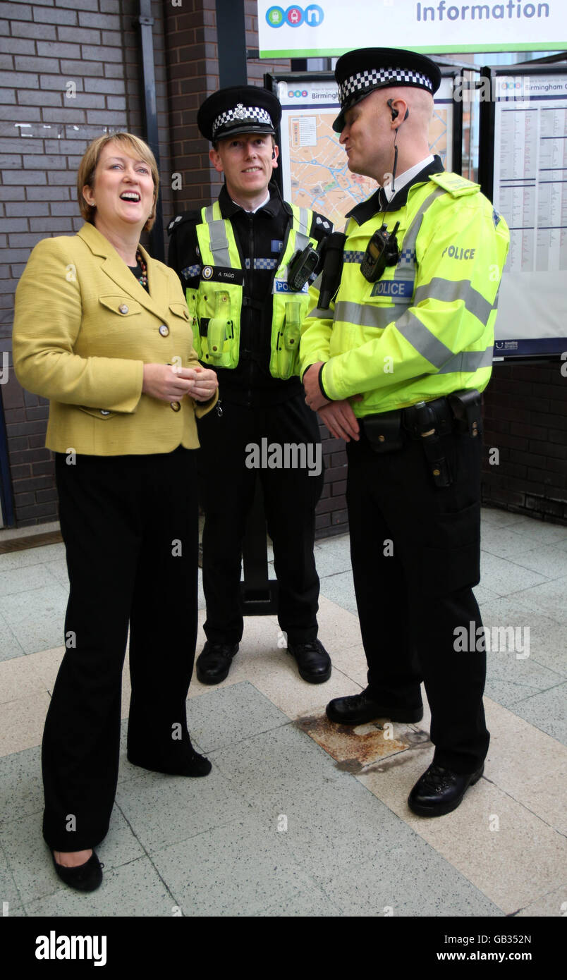 Home Secretary Jacqui Smith, smiles as she chats to police officers at ...