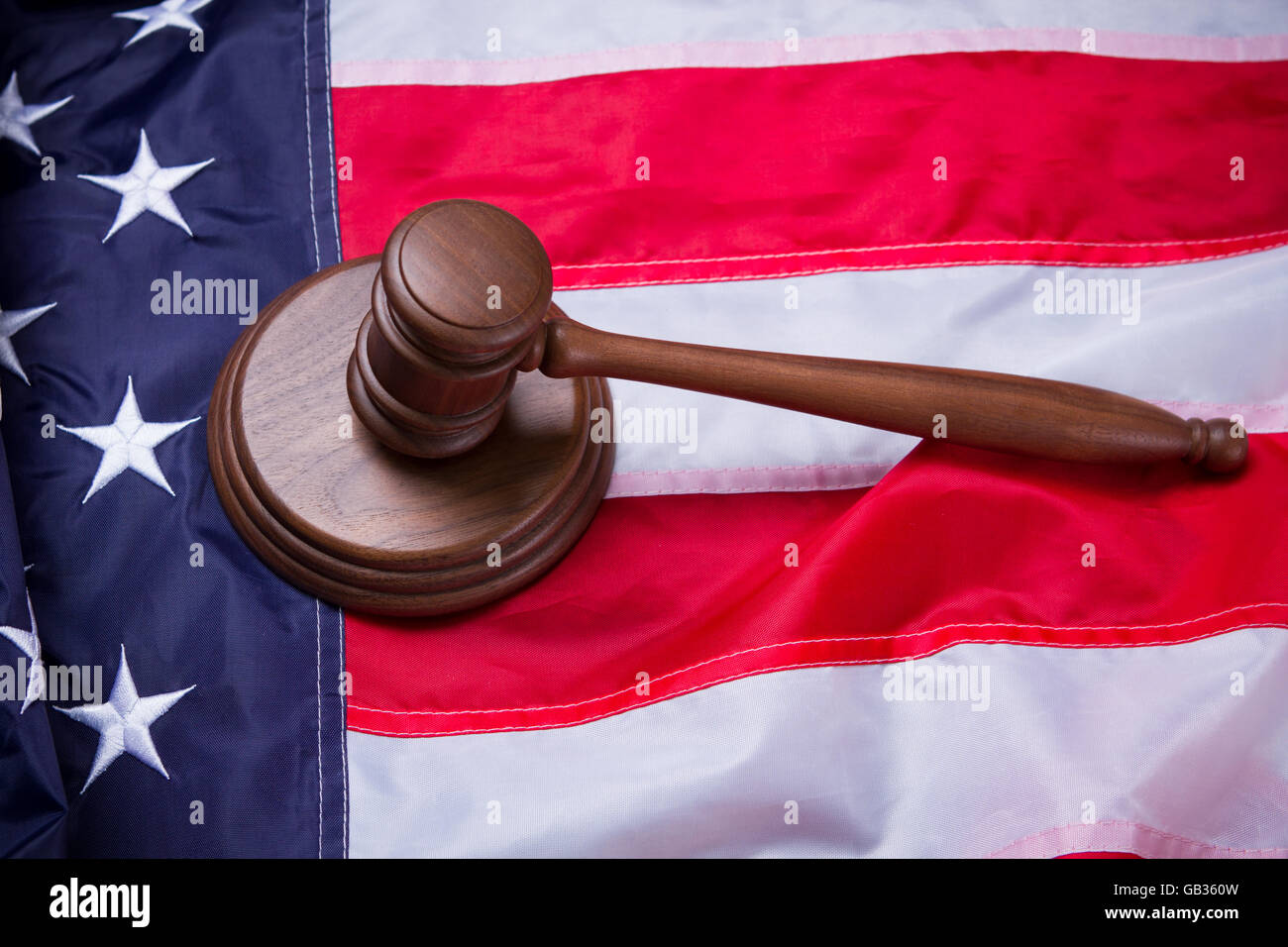 Gavel on USA flag. Brown gavel on american banner. System won't fail ...