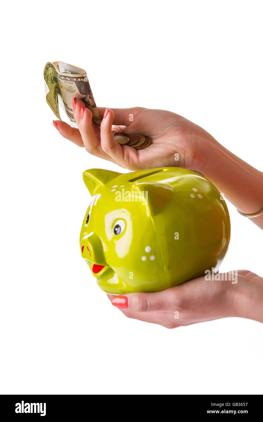 Girl's hand with money box. Dollars and lime piggy bank. Save money if ...