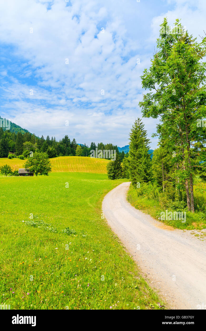 Road in countryside summer landscape of Alps Mountains, Weissensee lake ...