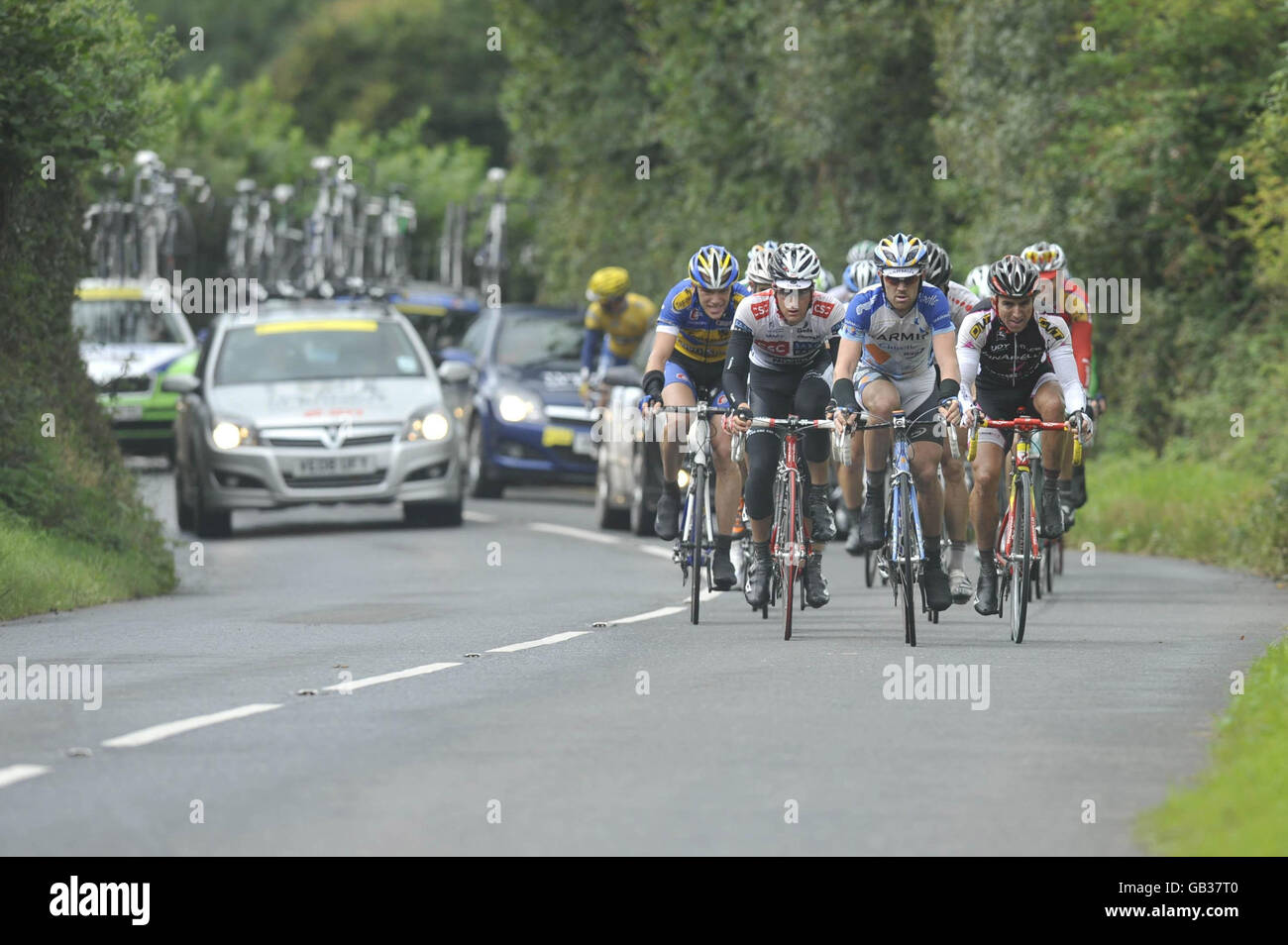 Cycling - Tour Of Britain - Stage Three - Chard. Competitors pass ...