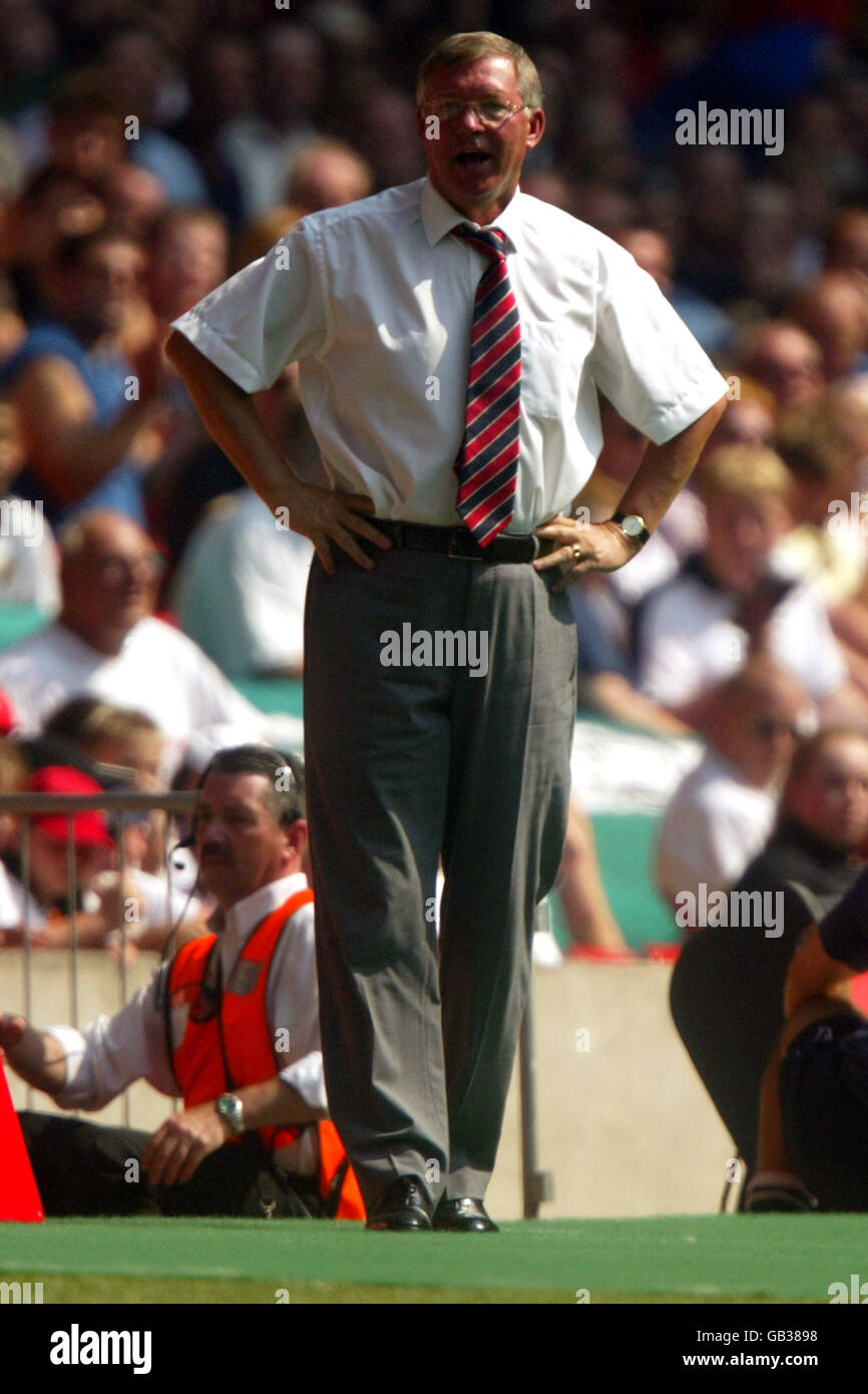 Manchester United manager Sir Alex Ferguson watches the action from the ...