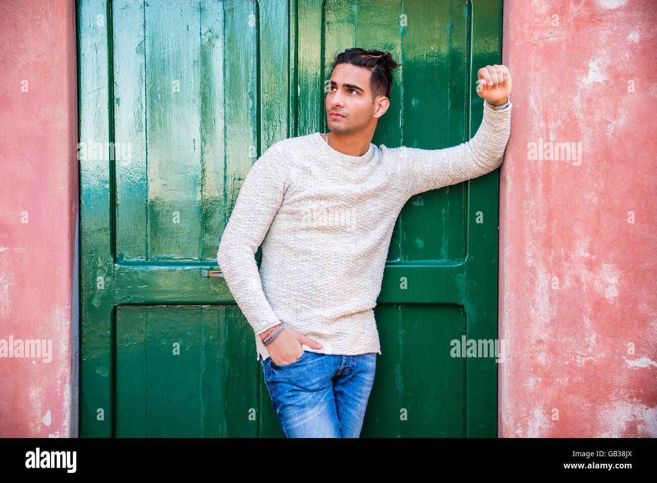 Old man leaning against wall hi-res stock photography and images - Alamy