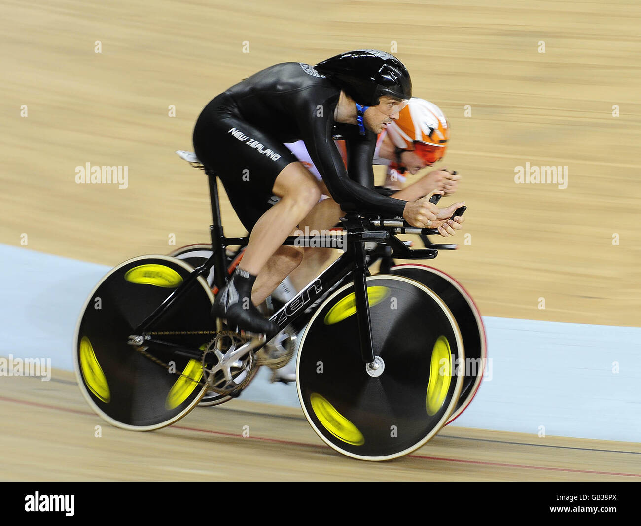 New Zealand cyclist Hayden Roulston (in black) catches his opponent ...