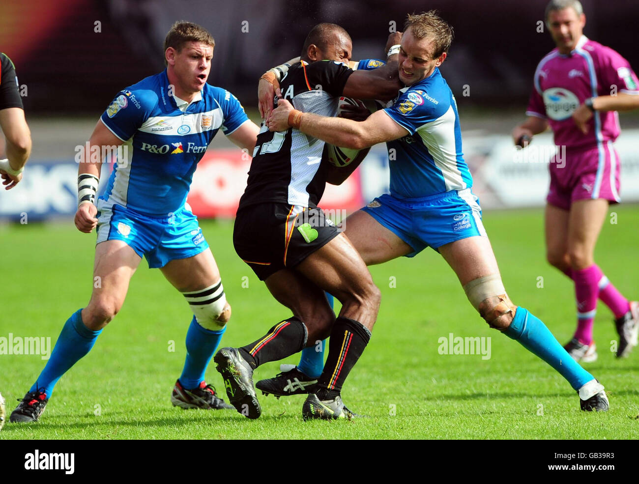 Bradford Bulls' Semi Tadulala is tackled by Hull FC's Ewan Dowes (right ...