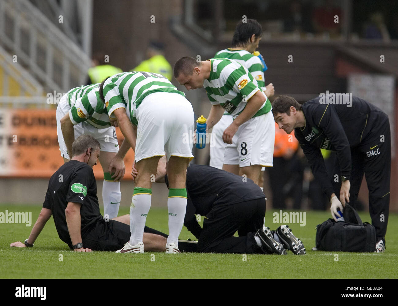 Match referee Charlie Richmond receives medical attention before ...