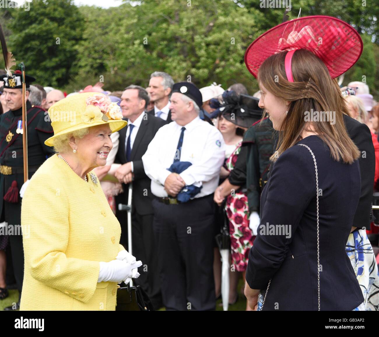 Queen Elizabeth II (left) attends a garden party at the Palace of ...