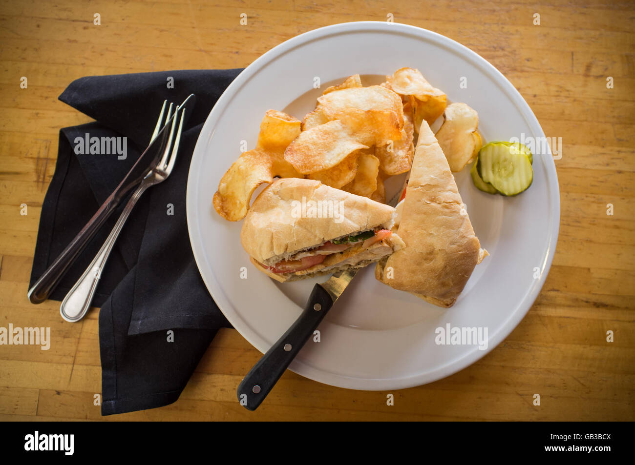 Grilled chicken panini with crispy home made chips Stock Photo - Alamy