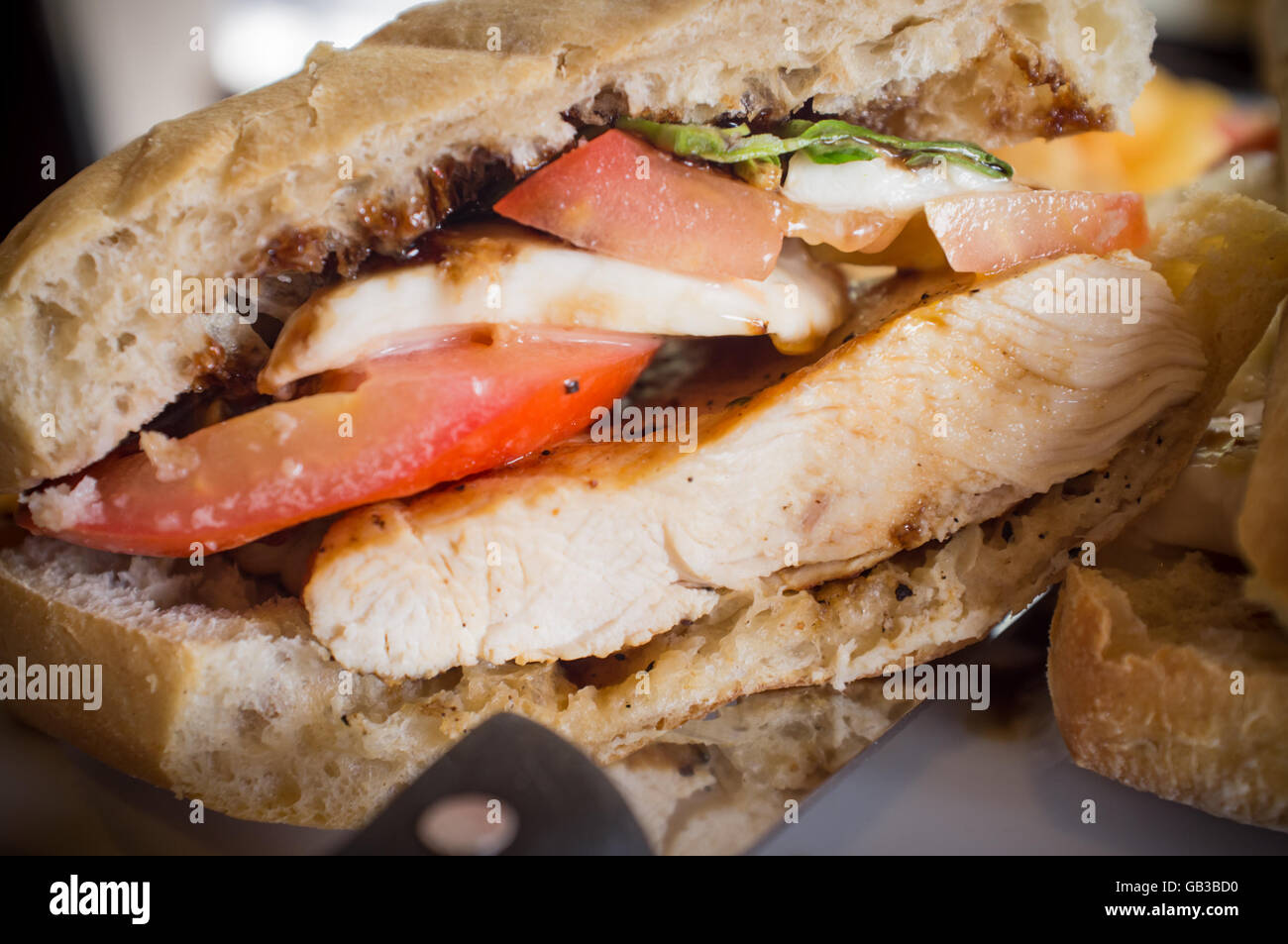 Grilled chicken panini with crispy home made chips Stock Photo - Alamy