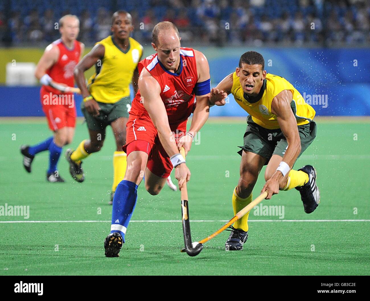 Great Britain's Ben Hawes (c) and South Africa's Clyde Abrahams battle ...