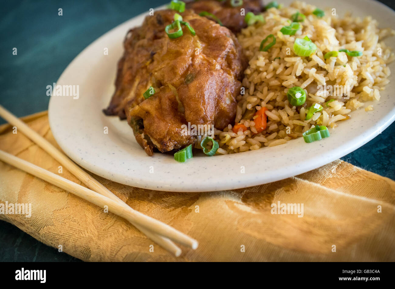 Chinese egg fu yung omelette with fried rice at restaurant Stock Photo ...