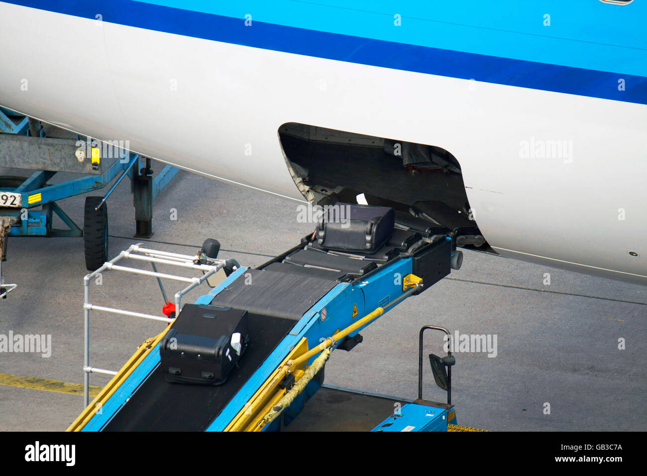 Loading conveyor to a plane Stock Photo - Alamy