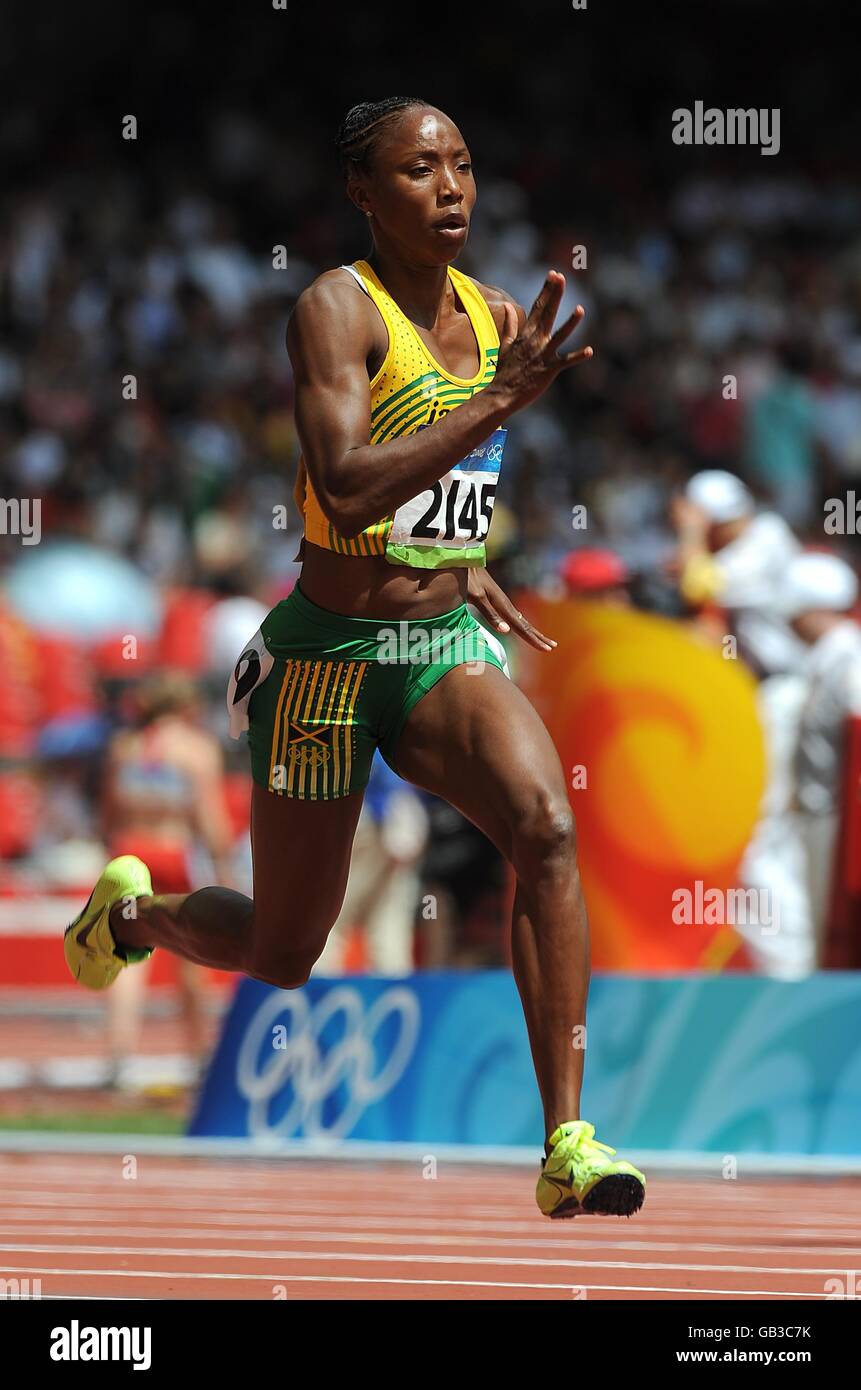 Jamaica's Sherone Simpson prepares to run in her Women's 100 metres ...