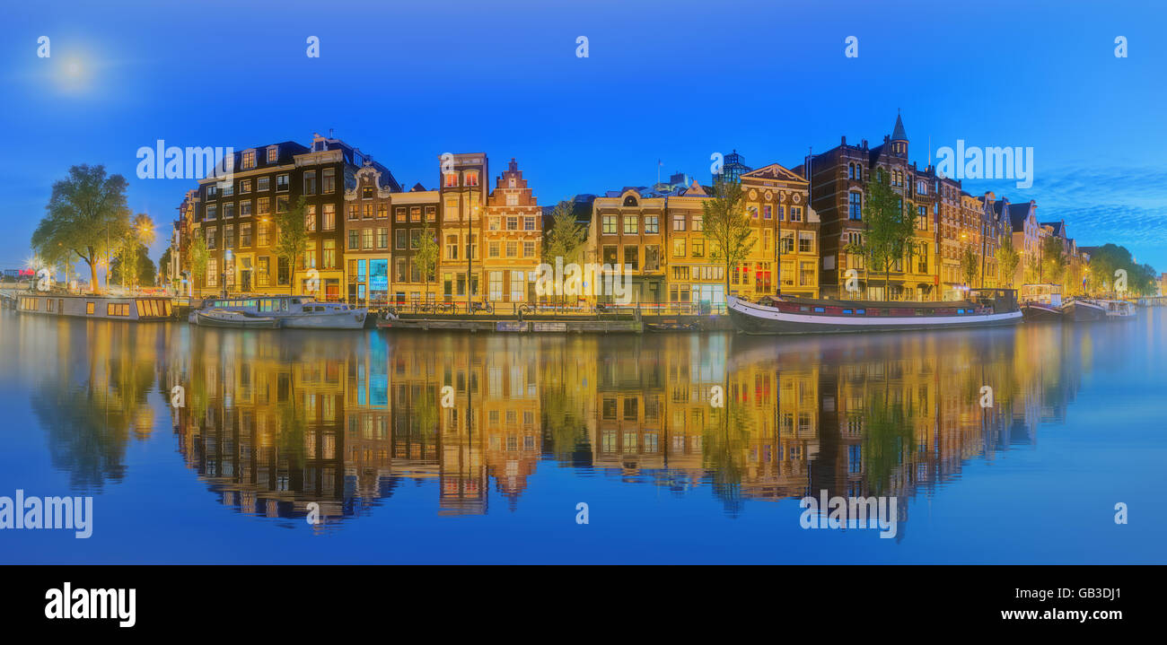 Amstel river, canals and night view of beautiful Amsterdam city ...