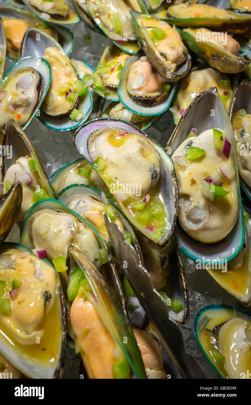 Pile of fresh seasoned mussel shellfish served cold on ice Stock Photo ...