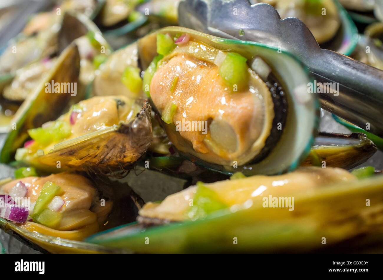 Pile of fresh seasoned mussel shellfish served cold on ice Stock Photo ...