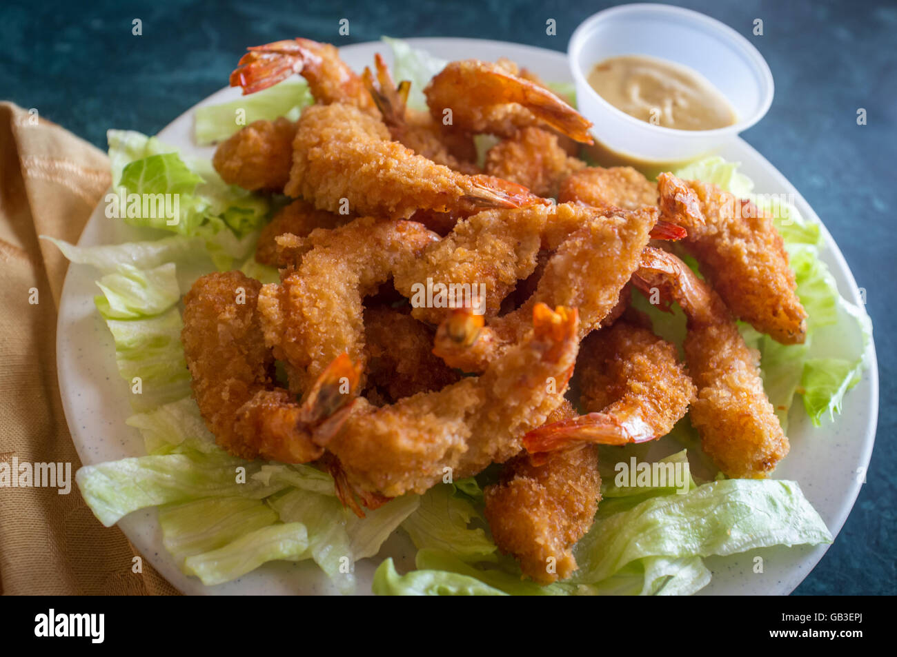 Large serving of popcorn shrimp tempura appetizer on bed of lettuce ...