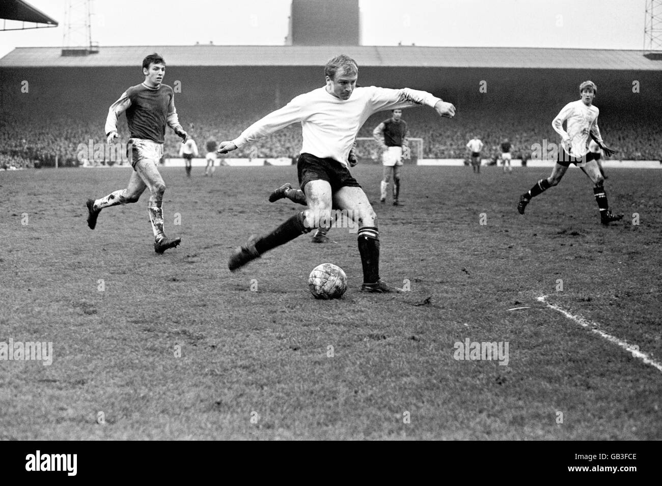 Manchester City's Francis Lee (c) shoots for goal, watched by teammate ...